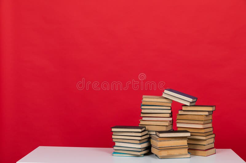 Stacks of Old Books for Teaching in the Library on a Red Background ...