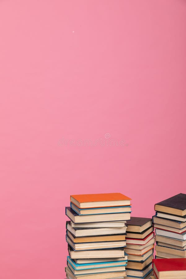 Stacks of Old Books for Teaching in the Library on a Pink Background at ...