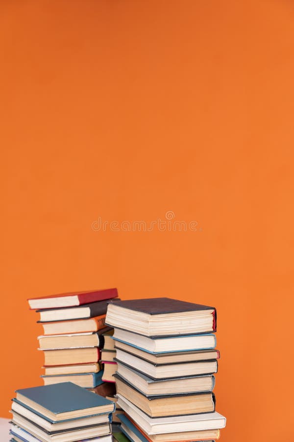 Stacks of Old Library Books on an Orange University Background Stock ...