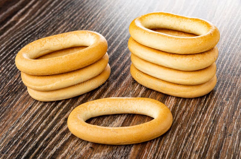 Stacks of Oval Bread Rings on Wooden Table Stock Photo - Image of ...