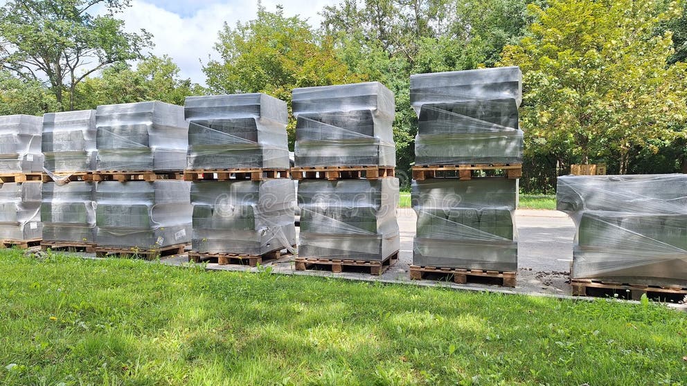 Stacks of Palletized Goods Wrapped in Plastic Outdoors Stock Photo ...
