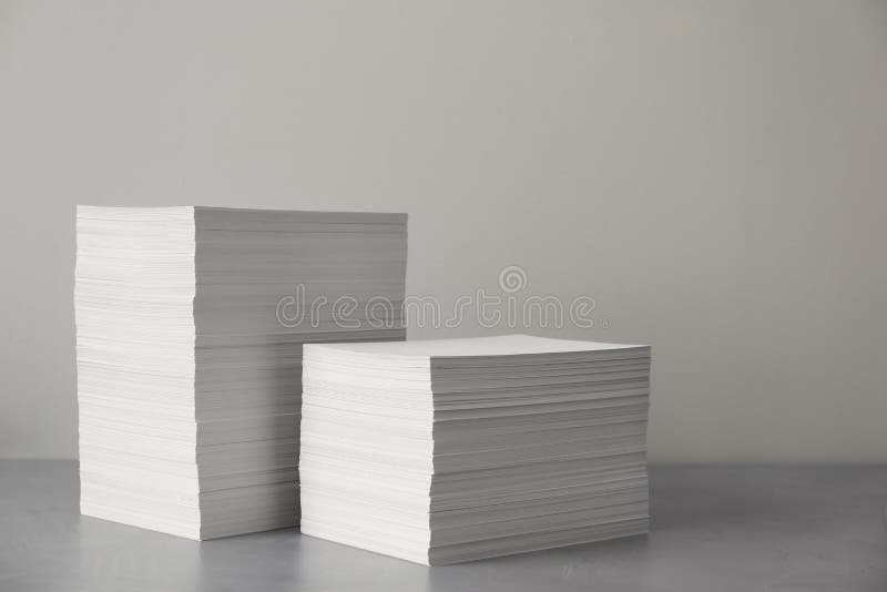 Stacks of Paper Sheets on Grey Table Stock Photo - Image of high, form ...