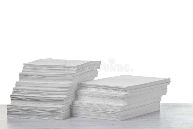 Stacks of Paper Sheets on Light Wooden Table Against White Background ...