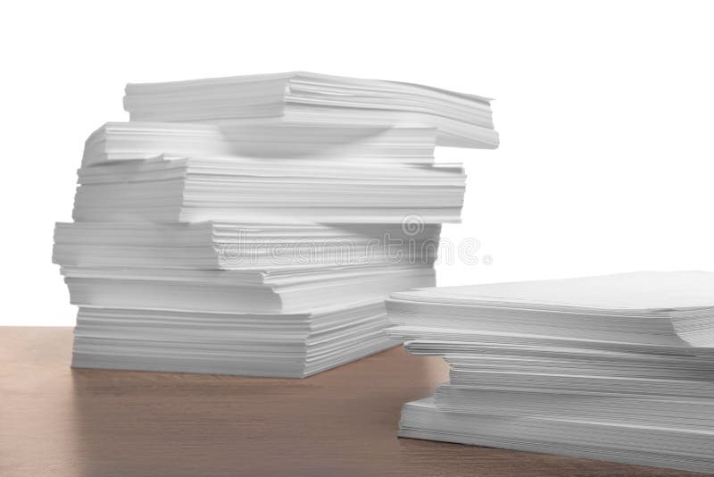 Stacks of Paper Sheets on Wooden Table Against White Background Stock ...