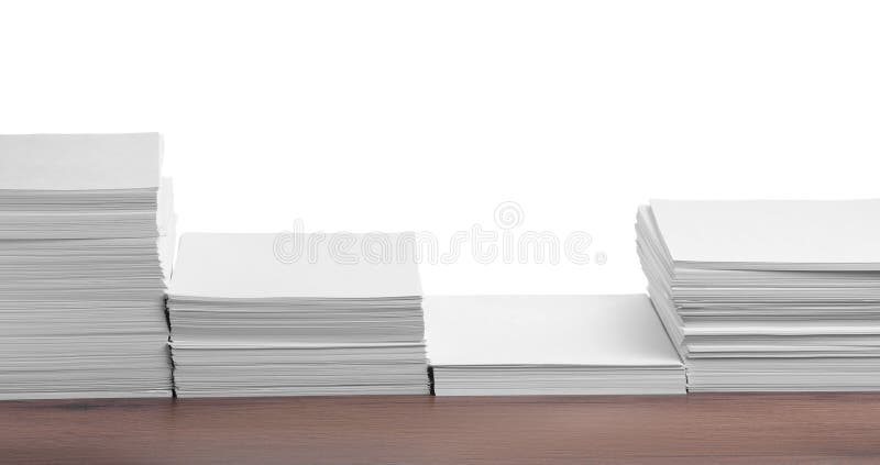 Stacks of Paper Sheets on Wooden Table Against White Background Stock ...