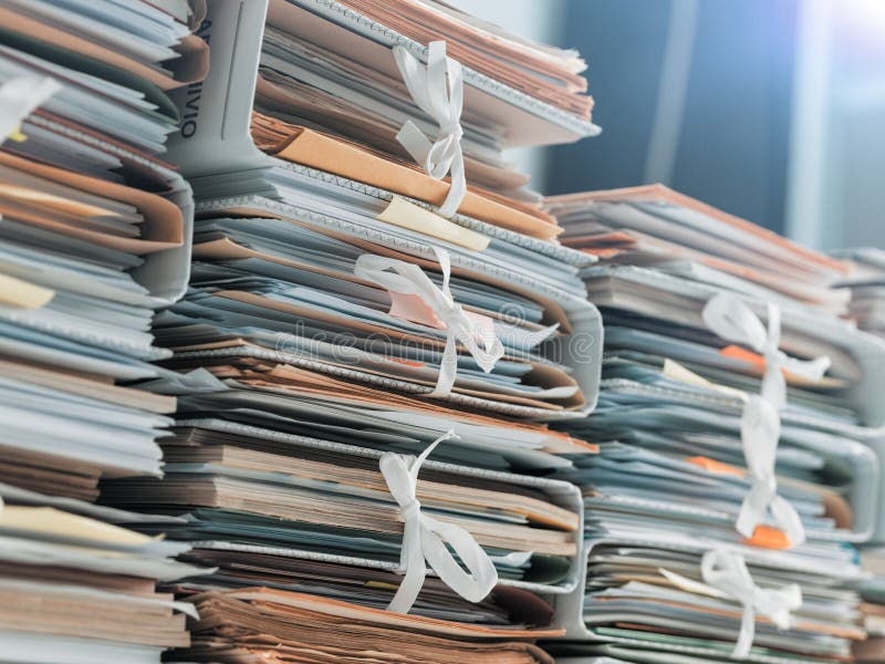 Man in stacks of paperwork stock photo. Image of clerk - 41842594