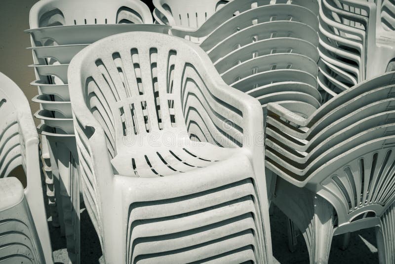 Stacks of plastic chairs stock photo. Image of background - 126789204