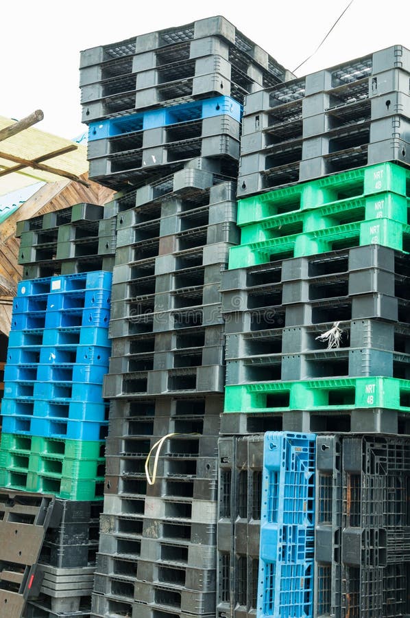 Stacks of plastic pallets stock image. Image of pallet - 74939329