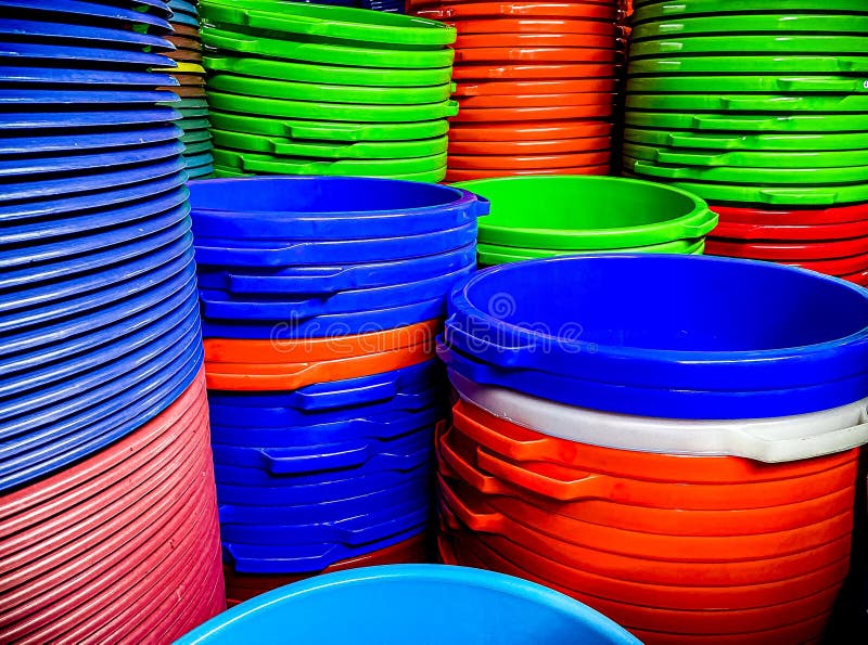 Stacks of Plastic Trays in Different Colors Stock Photo - Image of ...