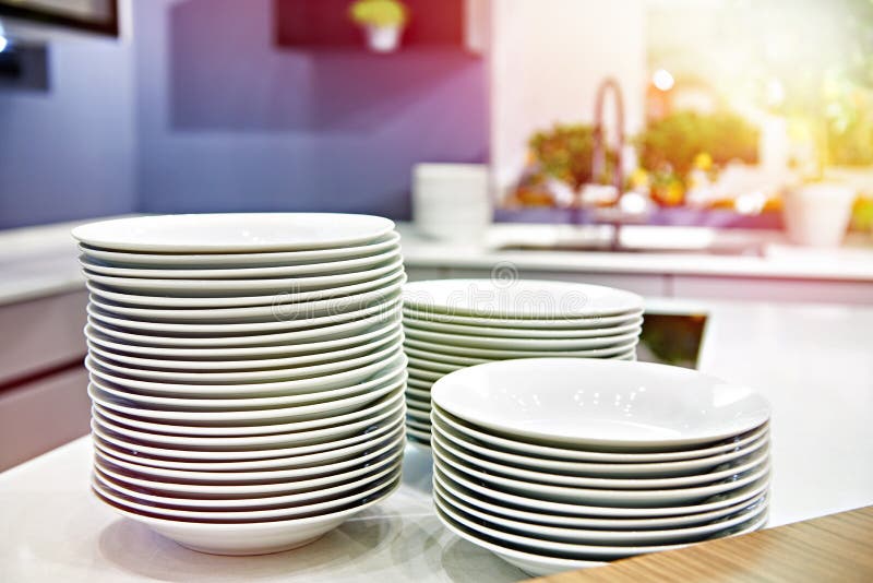 Stacks of Plates on Kitchen Table Stock Image - Image of dishes ...