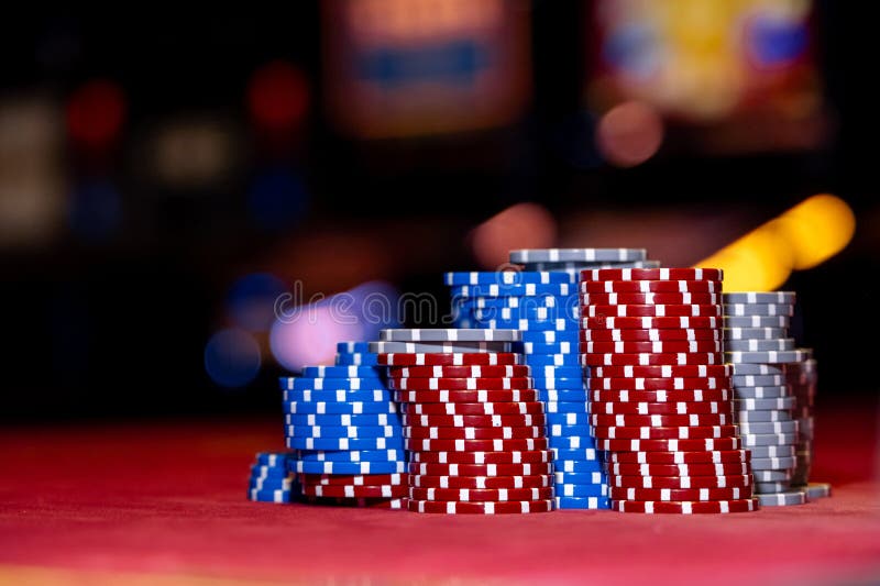 Stacks of Playing Chips on Casino Table. Chips for Poker on Shiny ...