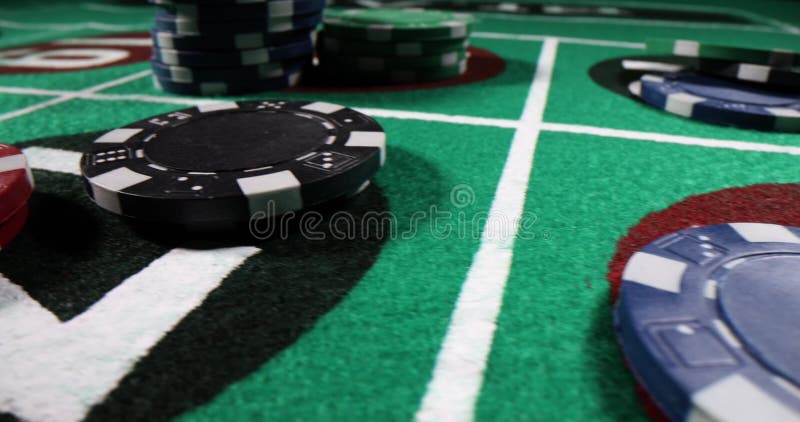 Stacks of Poker Chips, Cards and Cash on Green Felt Table Stock Video ...