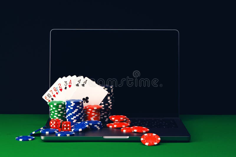 Stacks of Poker Chips and Playing Cards on a Laptop Computer. Stock ...
