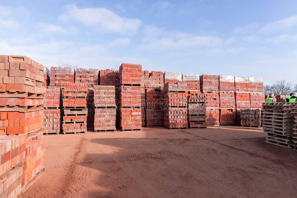 Stacks of Red Bricks and Pallets Outdoors on a Construction Site Stock ...