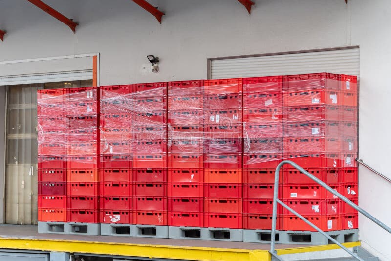 Stacks of Red Boxes on Flights in the Warehouse Loading Dock. Stock ...