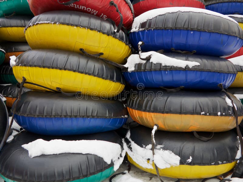 Stacked Colorful Snow Tubes Stock Image - Image of rope, blue: 29781181