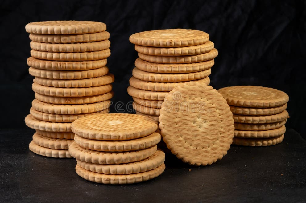 Stacks of Round, Golden-brown Biscuits with a Textured Edge, Arranged ...