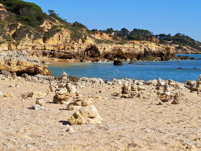 Stacks of Stones in Front of Blue Ocean Stock Image - Image of piles ...