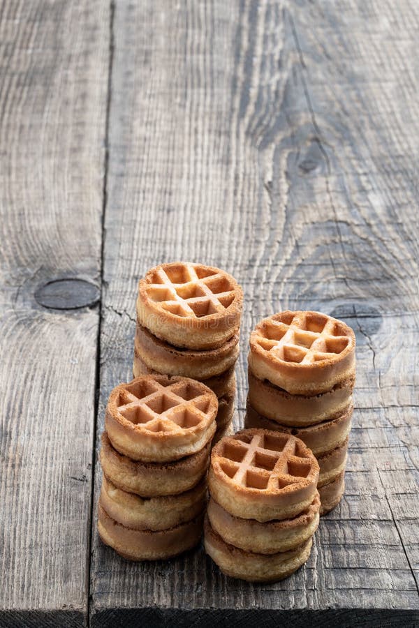 Stacks of Tasty Round Mini Waffles on Wooden Table Stock Photo - Image ...