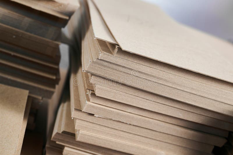 Stacks of Thick Paperboard Await Processing into Sturdy Cardboard Boxes ...