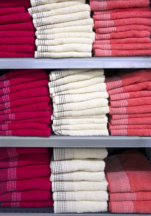 Stacks of Towels on a Store Shelf. Showcase with Textiles for Personal ...