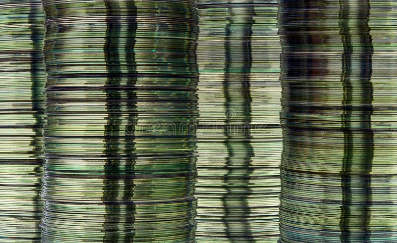Stacks of Translucent DVD and CD Computer Storage Disks Create a Data ...