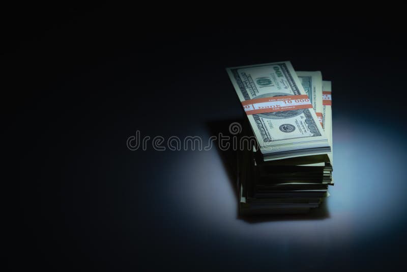 Stacks of US Dollar Bills Money Against Dark Background. Copy Space for ...