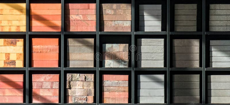 Stacks of Various Bricks on Shelves. Examples of Building Materials ...