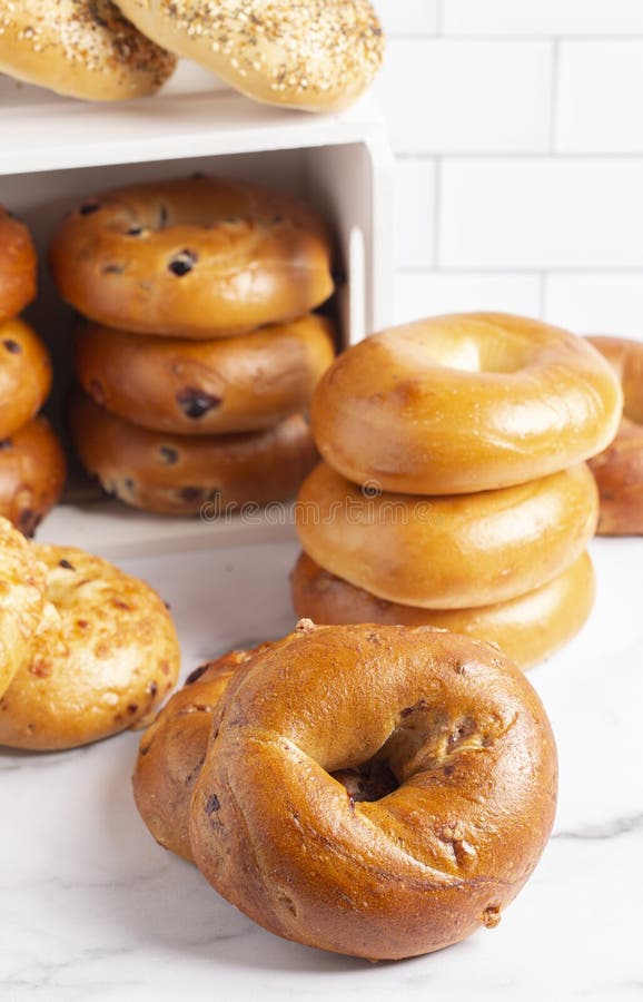 Stacks of Various Flavors of Bagels on a Counter Stock Image - Image of ...
