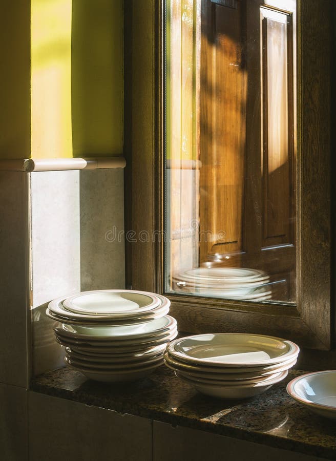 Stacks of White Plates on a Granite Counter Stock Image - Image of ...