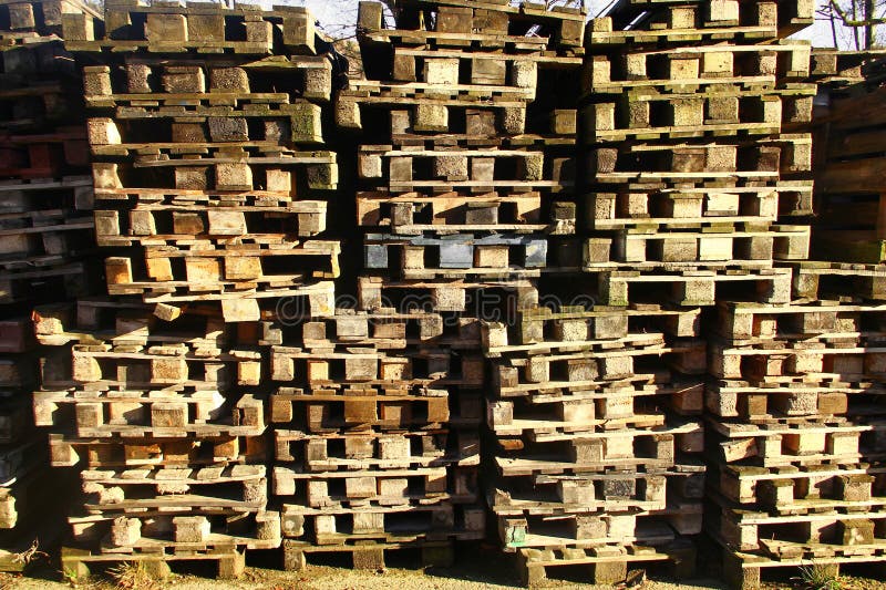 Stacks of Wooden Pallets in a Warehouse Stock Image - Image of pallet ...