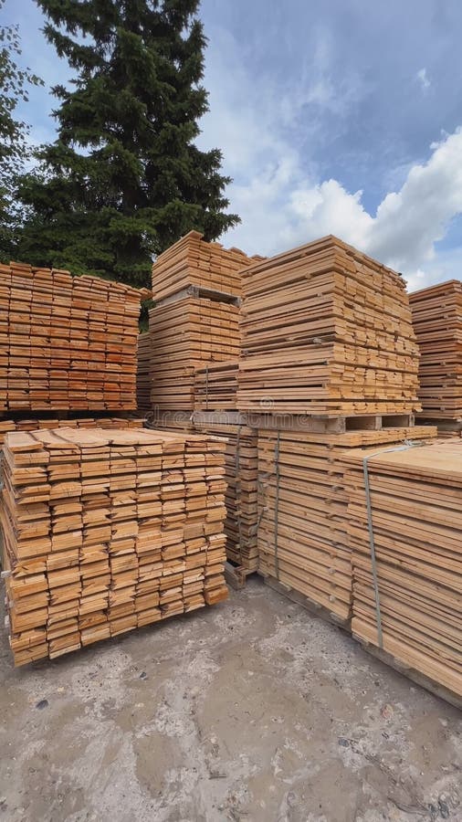Stacks of Wooden Planks Forming a Geometric Pattern in a Timber ...