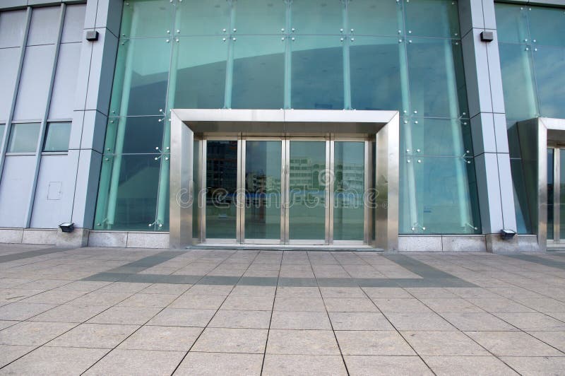 Revolving glass doors stock photo. Image of pavement, frame - 4106410
