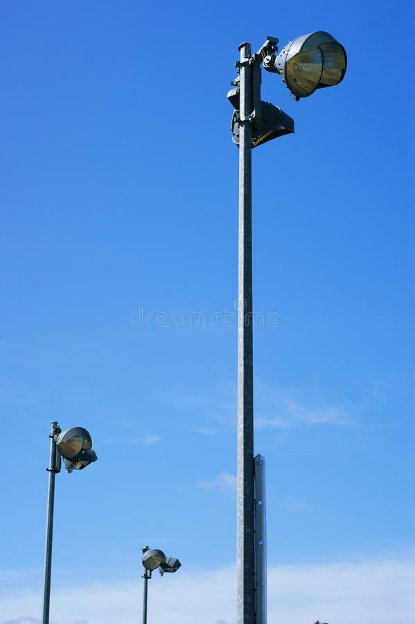 Stadium Field Lights Against the Blue Sky. Stock Photo - Image of light ...