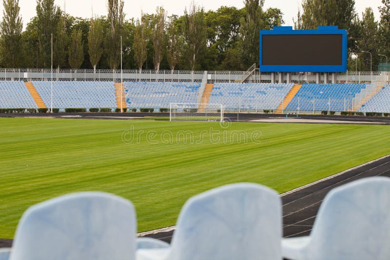 Stadium with a Football Field Stock Image - Image of field, bench ...