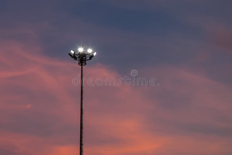 Stadium Lights Turned on and a Beautiful Sunset in the Background Stock ...