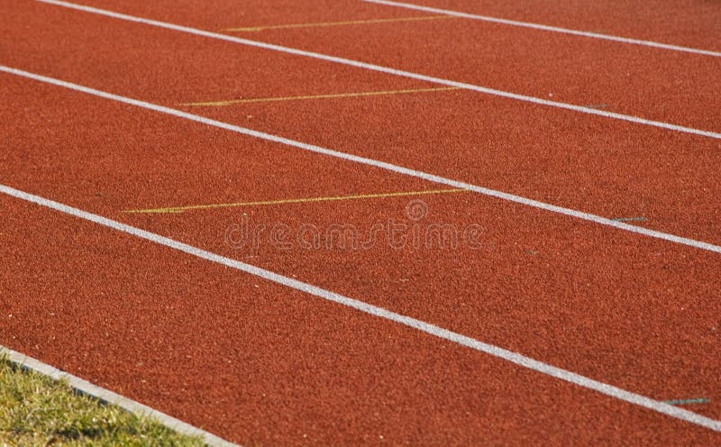 Stadium red plastic track stock image. Image of speed - 244575611