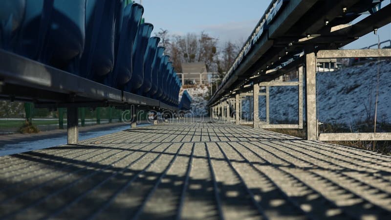 Stadium Seats Viewed from Behind, with the Stadium Visible through the ...