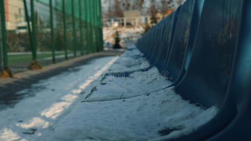 Stadium Seats Viewed from Behind, with the Stadium Visible through the ...