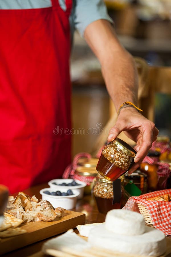 Staff Checking Pickle Jar at Counter in Market Stock Photo - Image of ...