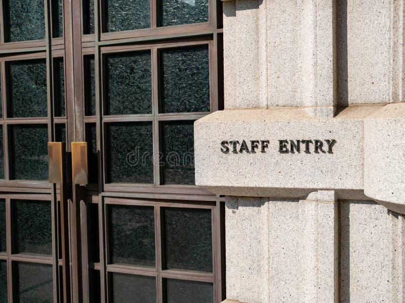 Staff Entry Sign Outside of Office Building Next To Double Doors Stock ...