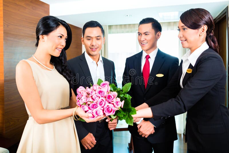 Staff Greeting Guests in Asian Hotel Stock Image - Image of indonesia ...