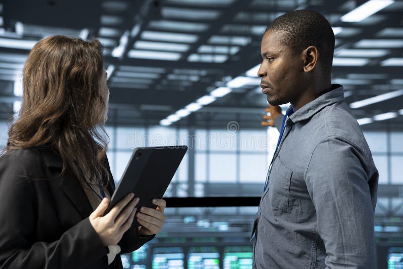 It Staff Members in Data Center Using Tablet, Verifying Rigs Stock ...