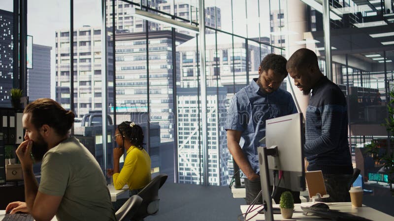 It Staff Members in Office Monitoring Company Systems Using Tablet ...