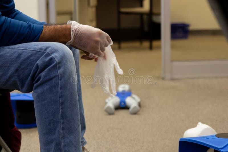 Staff Putting Medical Gloves for First Aid Training Stock Image - Image ...