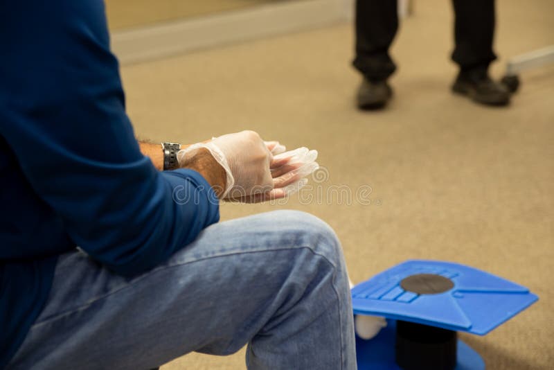 Staff Putting Medical Gloves for First Aid Training Stock Image - Image ...
