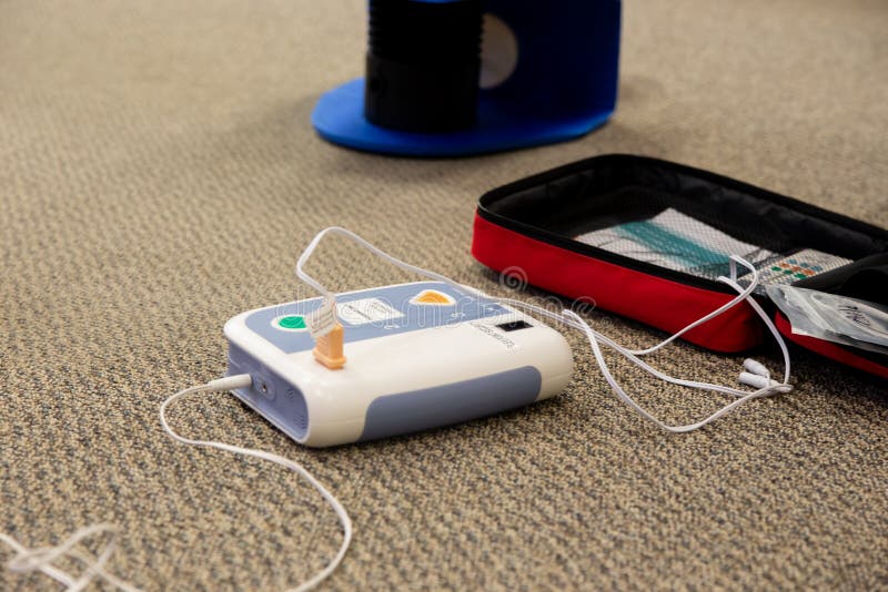 Staff Setting AED Machine To Practice First Aid Stock Image - Image of ...