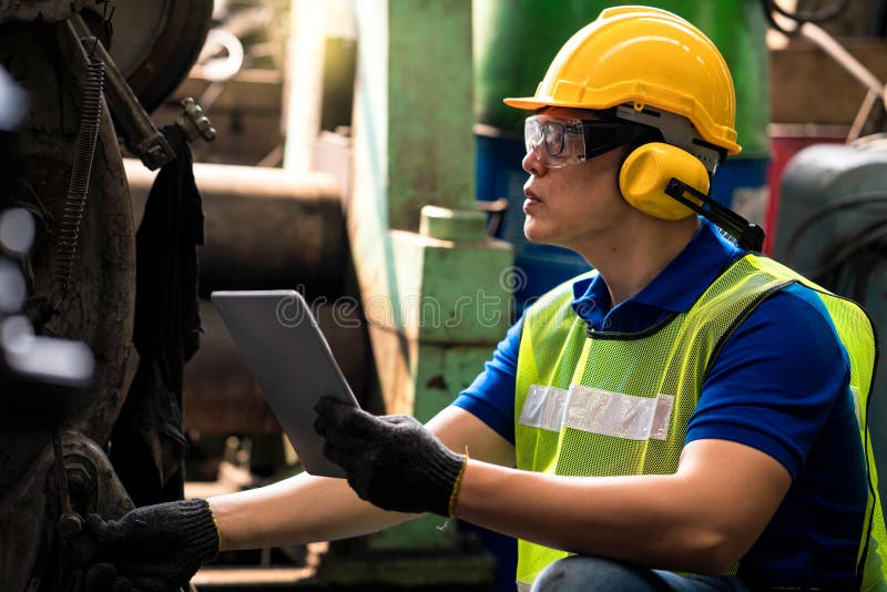 Staff or Technicians are Checking the Operation of the Old Machine Via ...