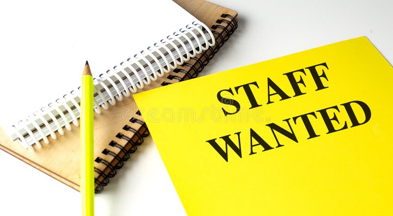 STAFF WANTED Text on Yellow Paper with Notebooks Stock Image - Image of ...