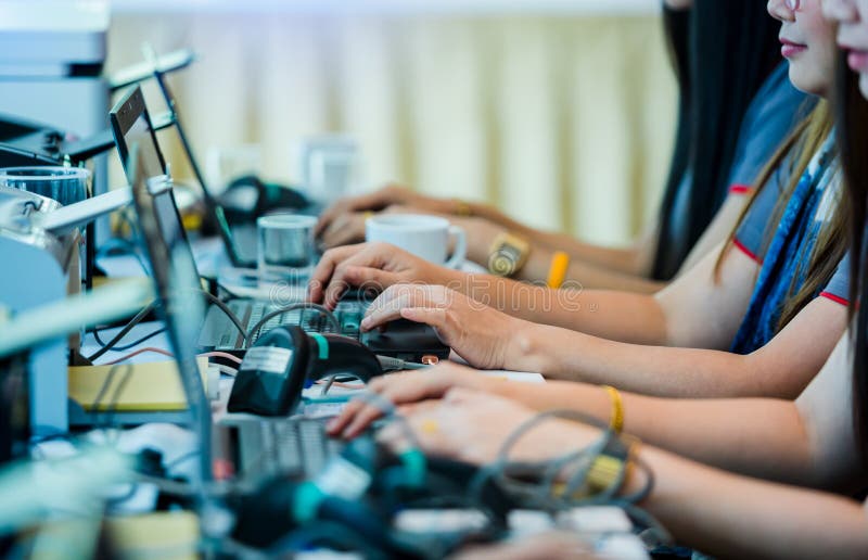 Staffs are Typing Information with Mouse for Register or Input Data ...